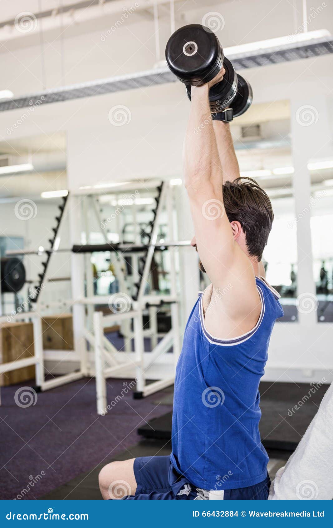 Muscular Man Lifting Dumbbells on Bench Stock Photo - Image of ...