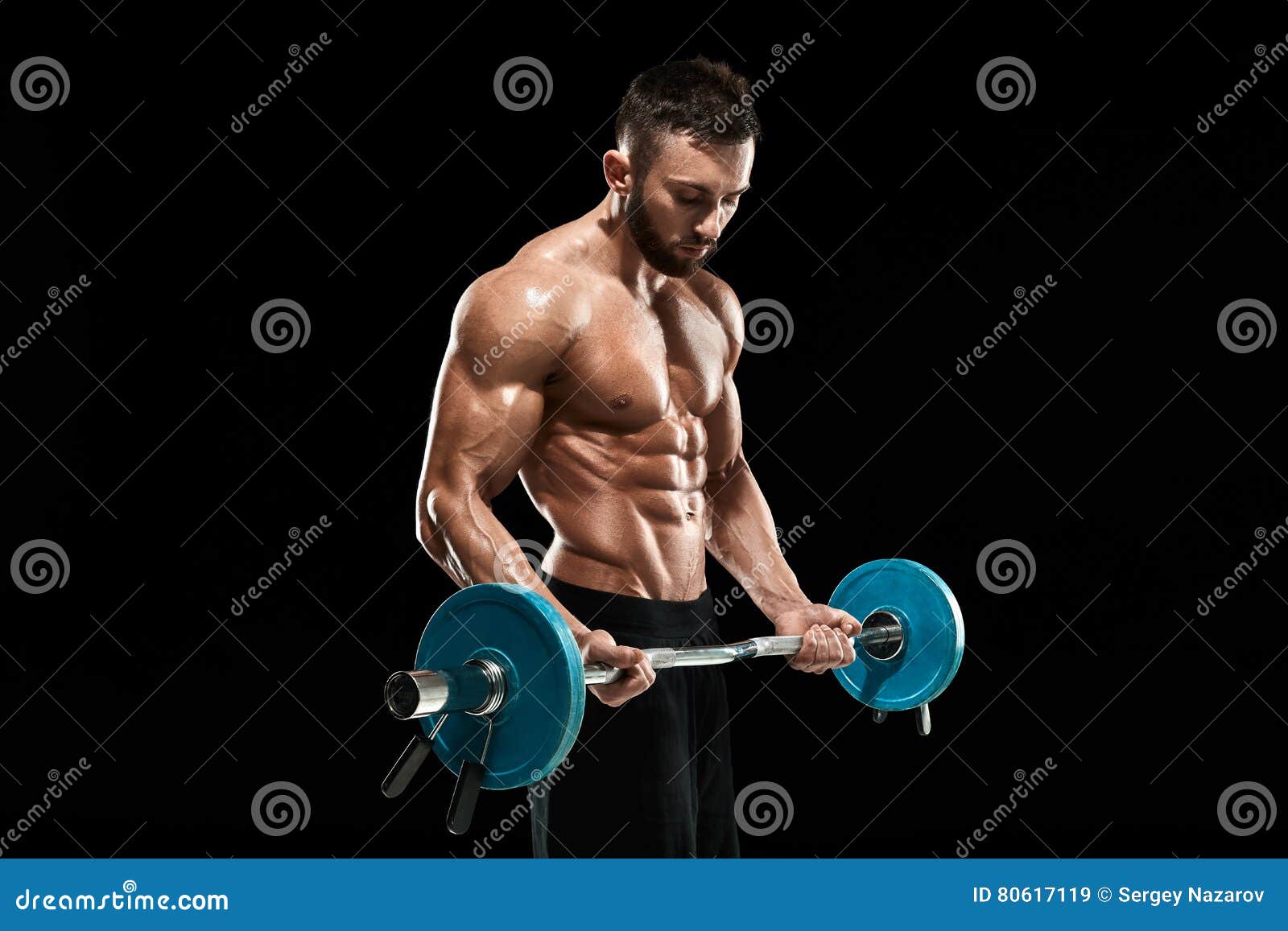 Muscular Man Lifting Weights Over Dark Background Stock Image - Image ...