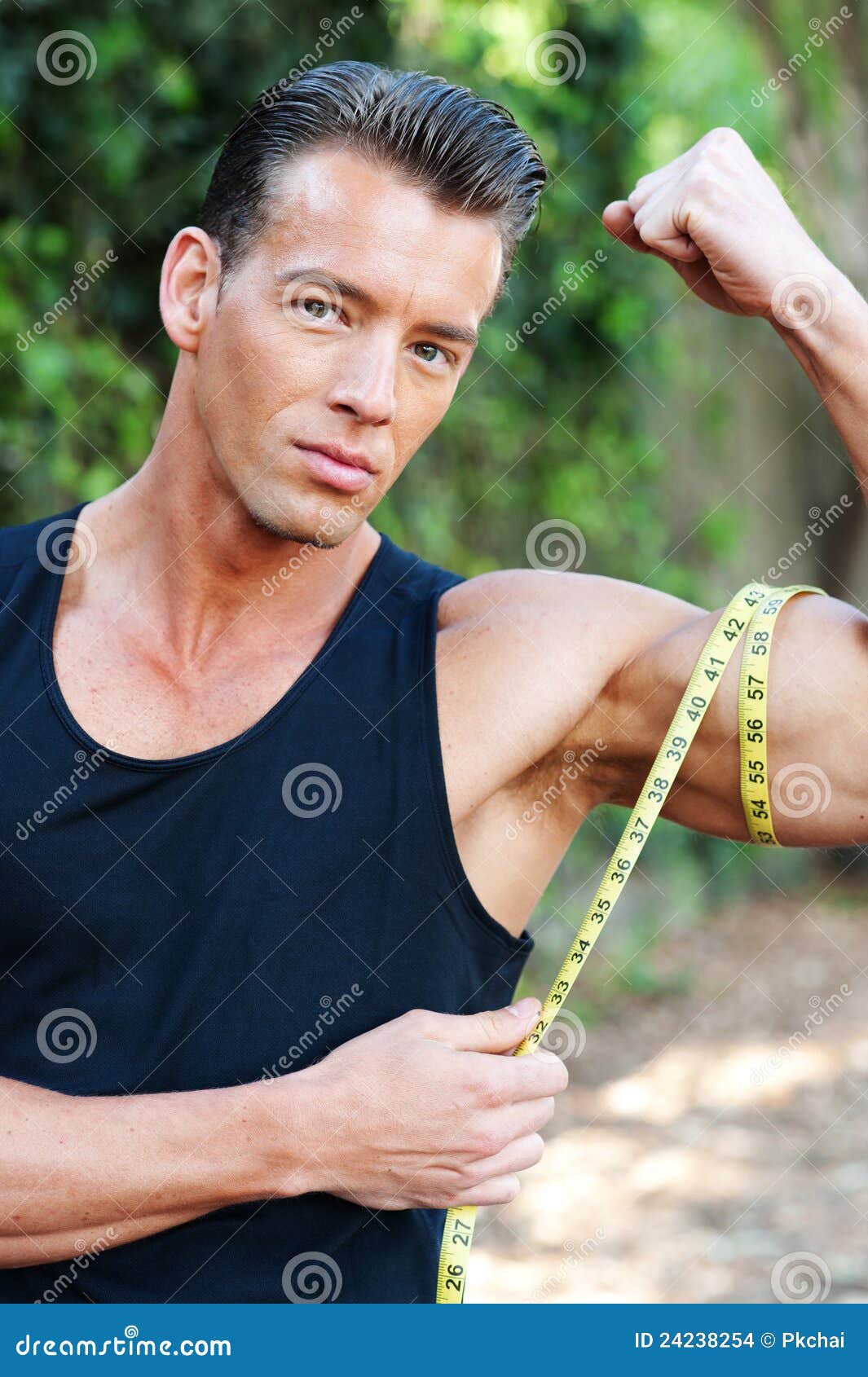 Muscular Man Measuring Bicep Stock Photo - Image of exercise, measure ...