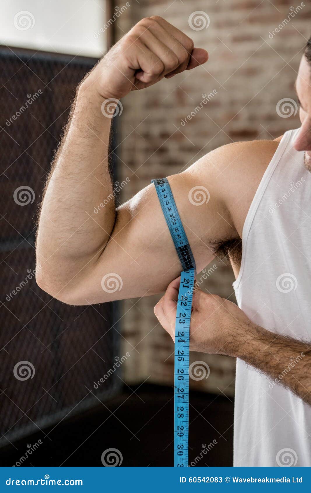 Muscular Man Measuring Biceps Stock Image - Image of heavy, slim: 60542083