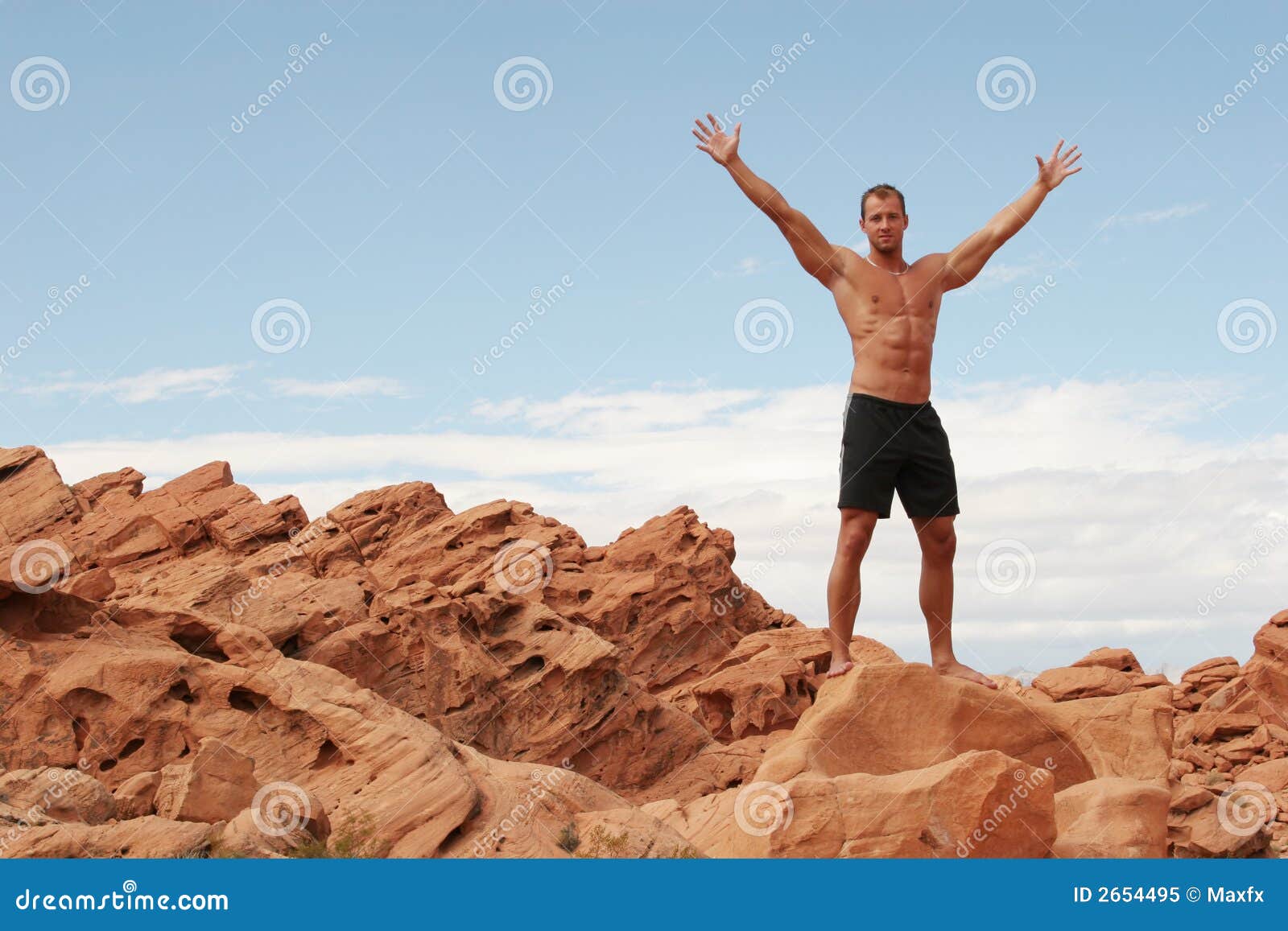 Muscular man on red rocks stock image. Image of bodybuilding - 2654495