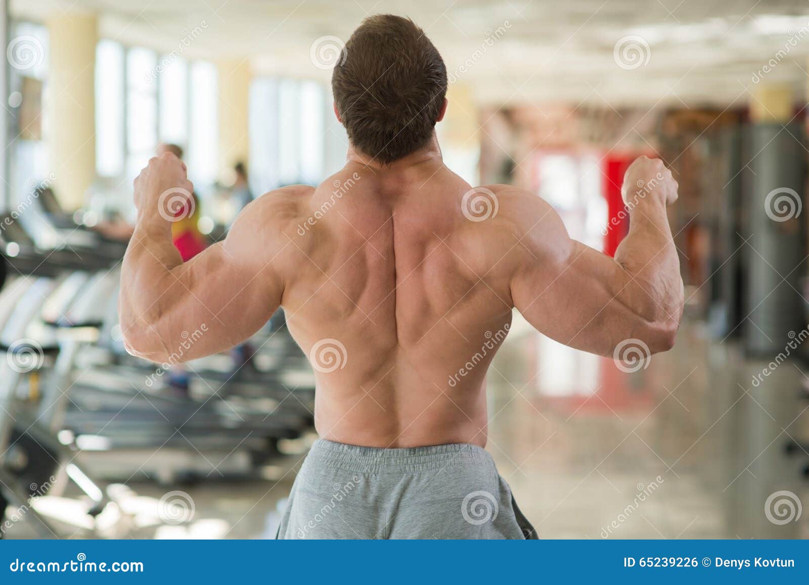 Muscular man Â€Â™s back. stock photo. Image of intention - 65239226