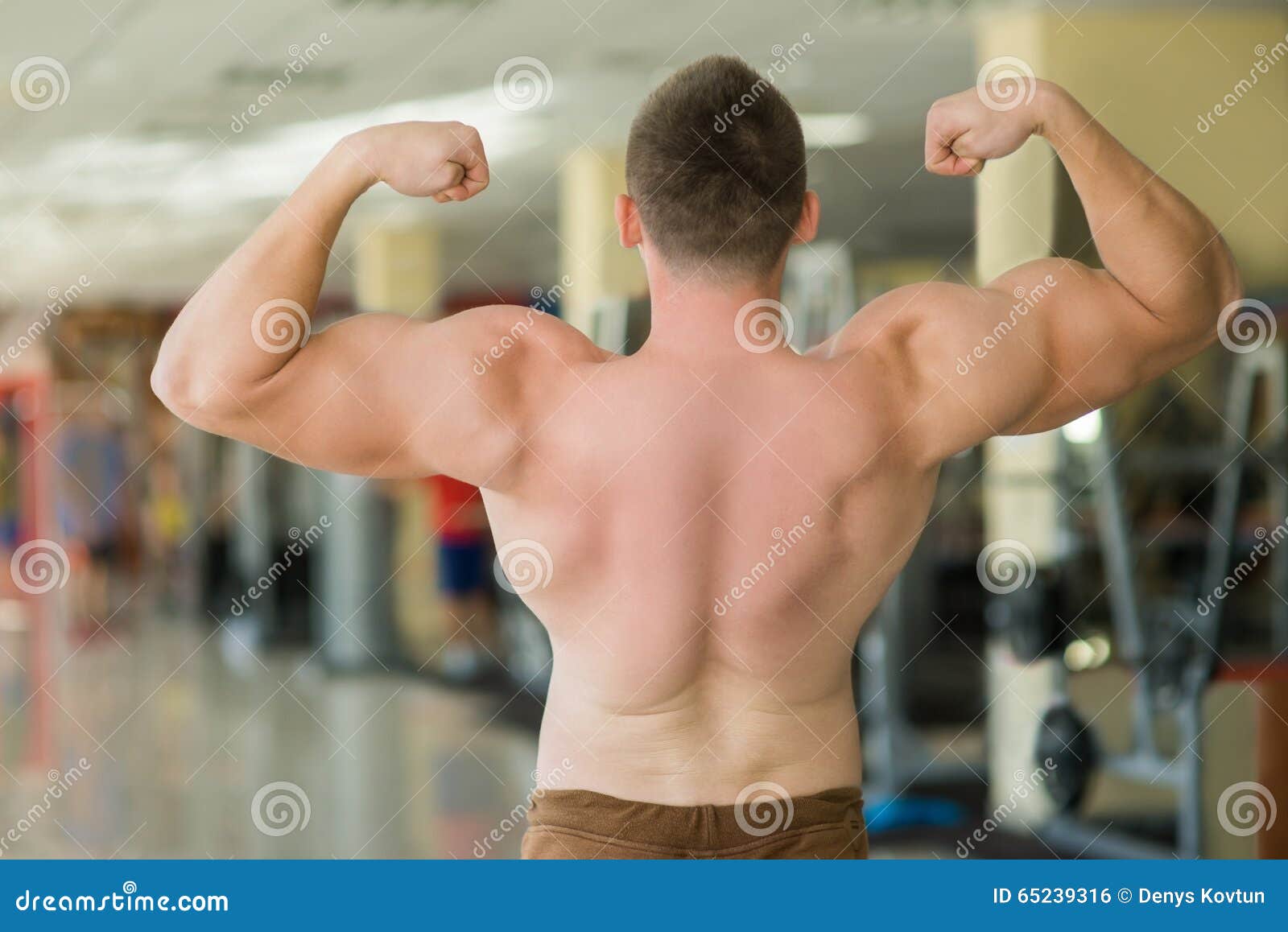 Muscular man s back. stock photo. Image of confident - 65239316
