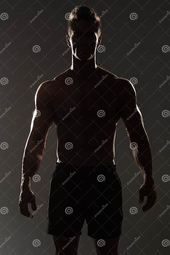 Muscular man in shadow stock image. Image of healthy - 61217467