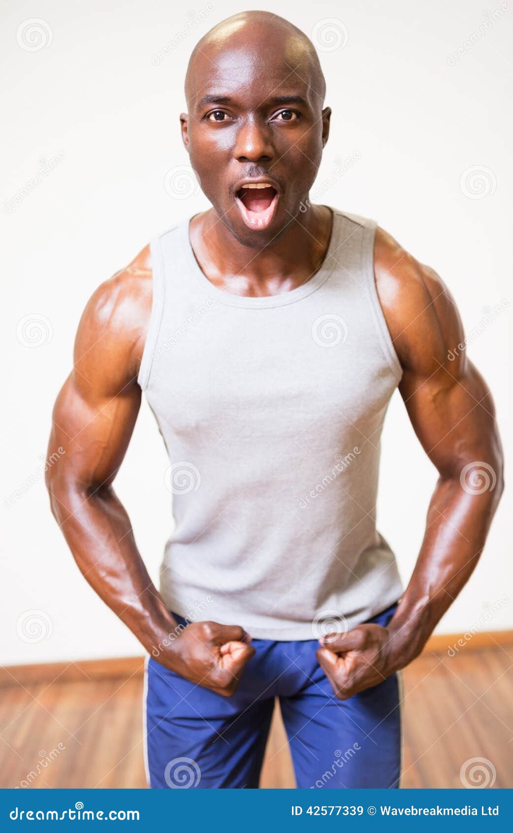 Muscular Man Shouting while Flexing Muscles Stock Image - Image of ...
