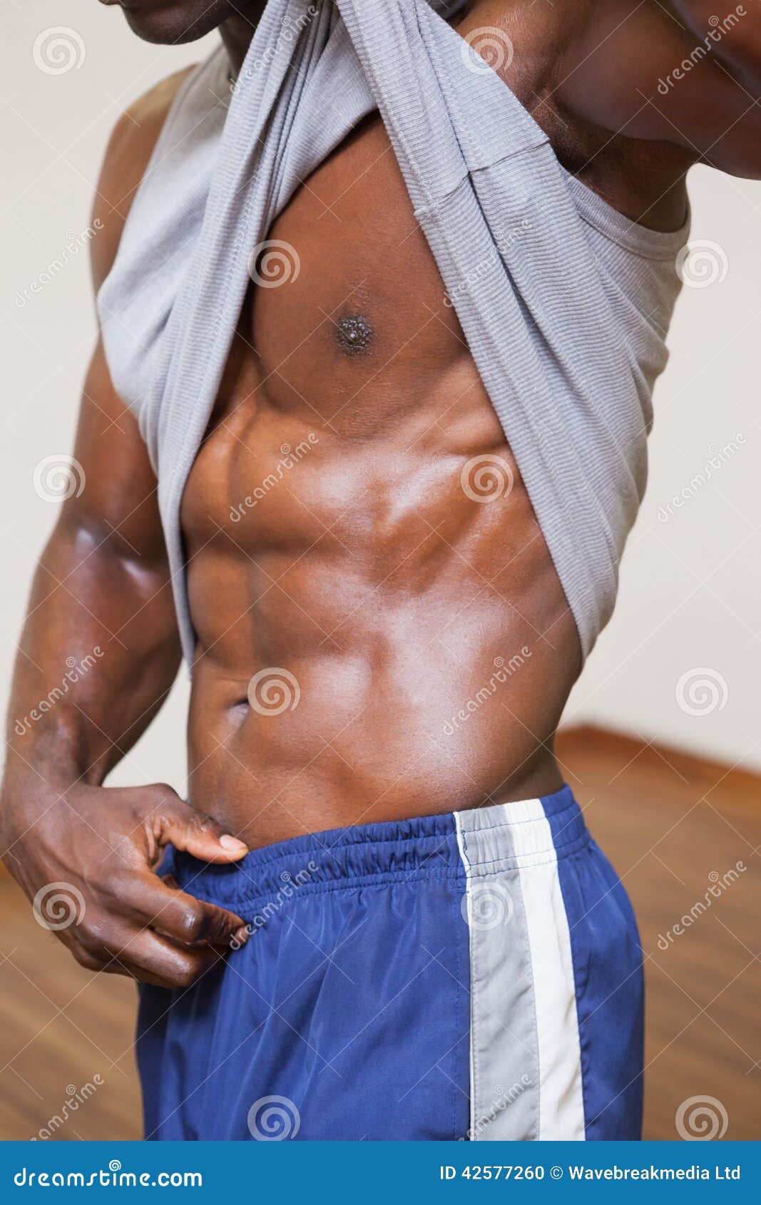 Muscular Man Showing His Abs Stock Photo - Image of male, bare: 42577260