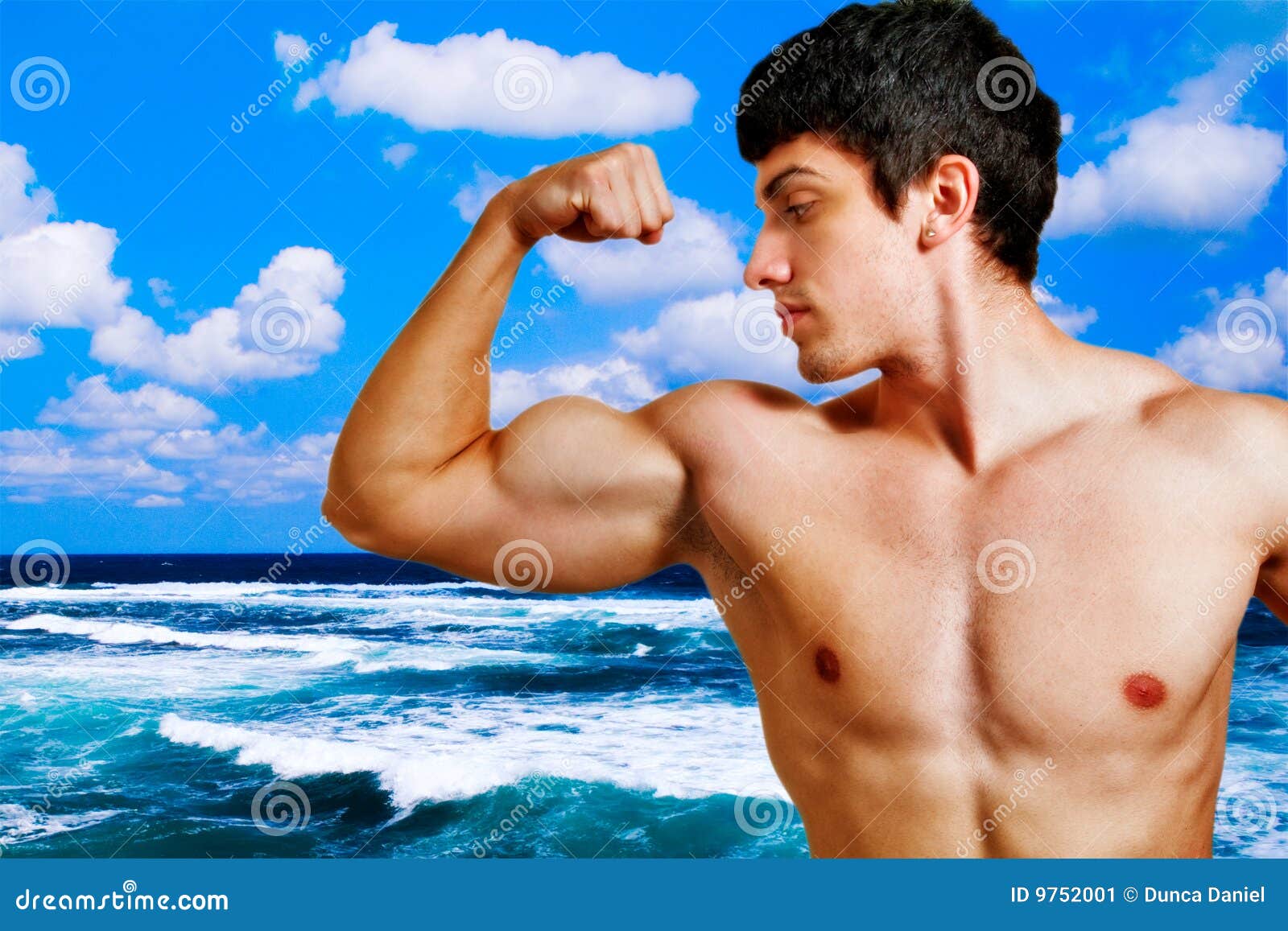 Muscular Man Showing His Biceps on the Beach Stock Image - Image of ...