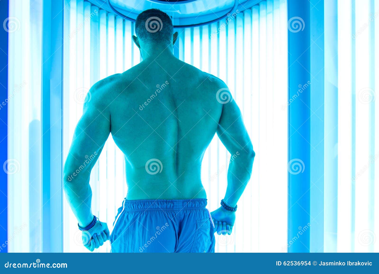 Muscular Man at Solarium in Beauty Salon Stock Photo - Image of ...