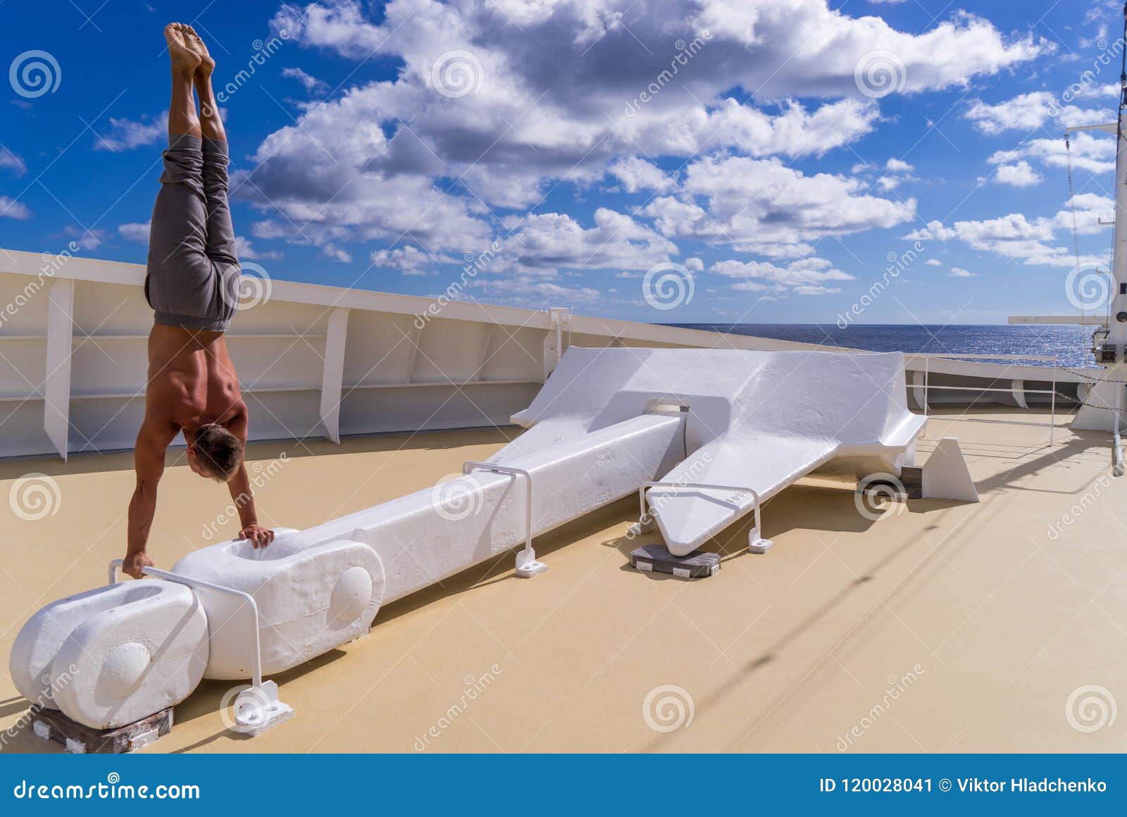 Muscular Man Standing on Huge Anchor on the Bow of Cruise Ship Stock ...
