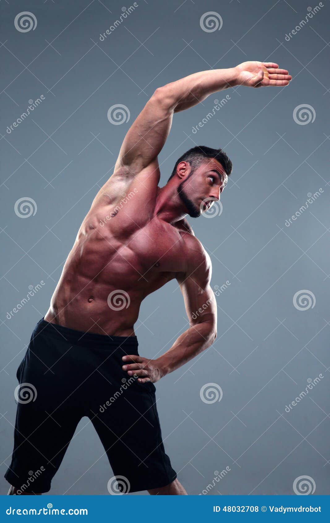 Muscular man stretching stock photo. Image of muscular - 48032708