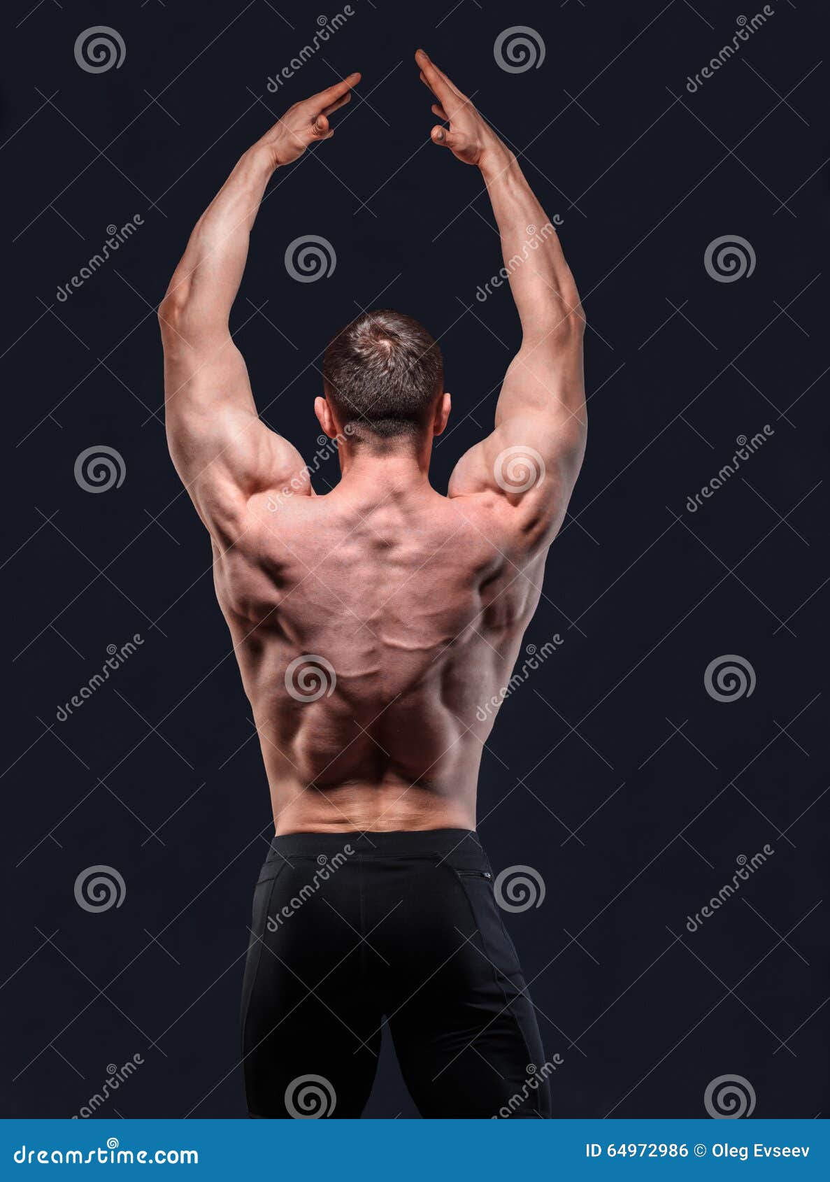 Muscular Man in Studio Show His Back with Hands Stock Photo - Image of ...