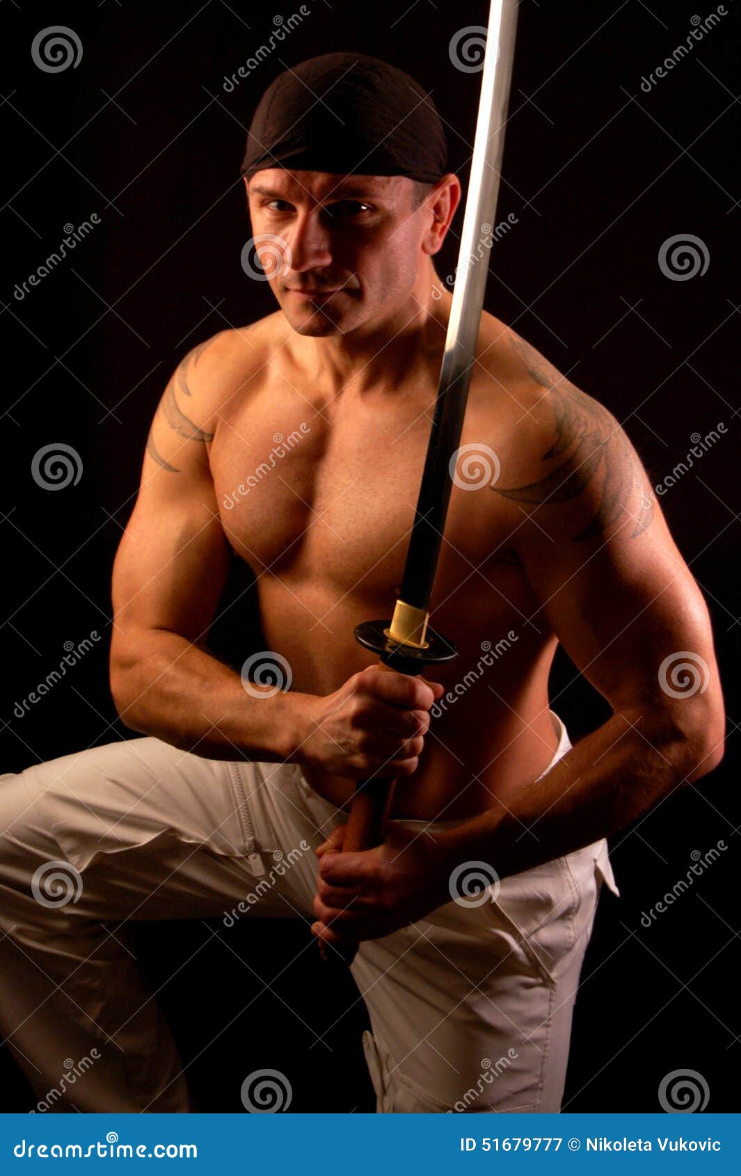 Muscular man with sword stock image. Image of portrait - 51679777