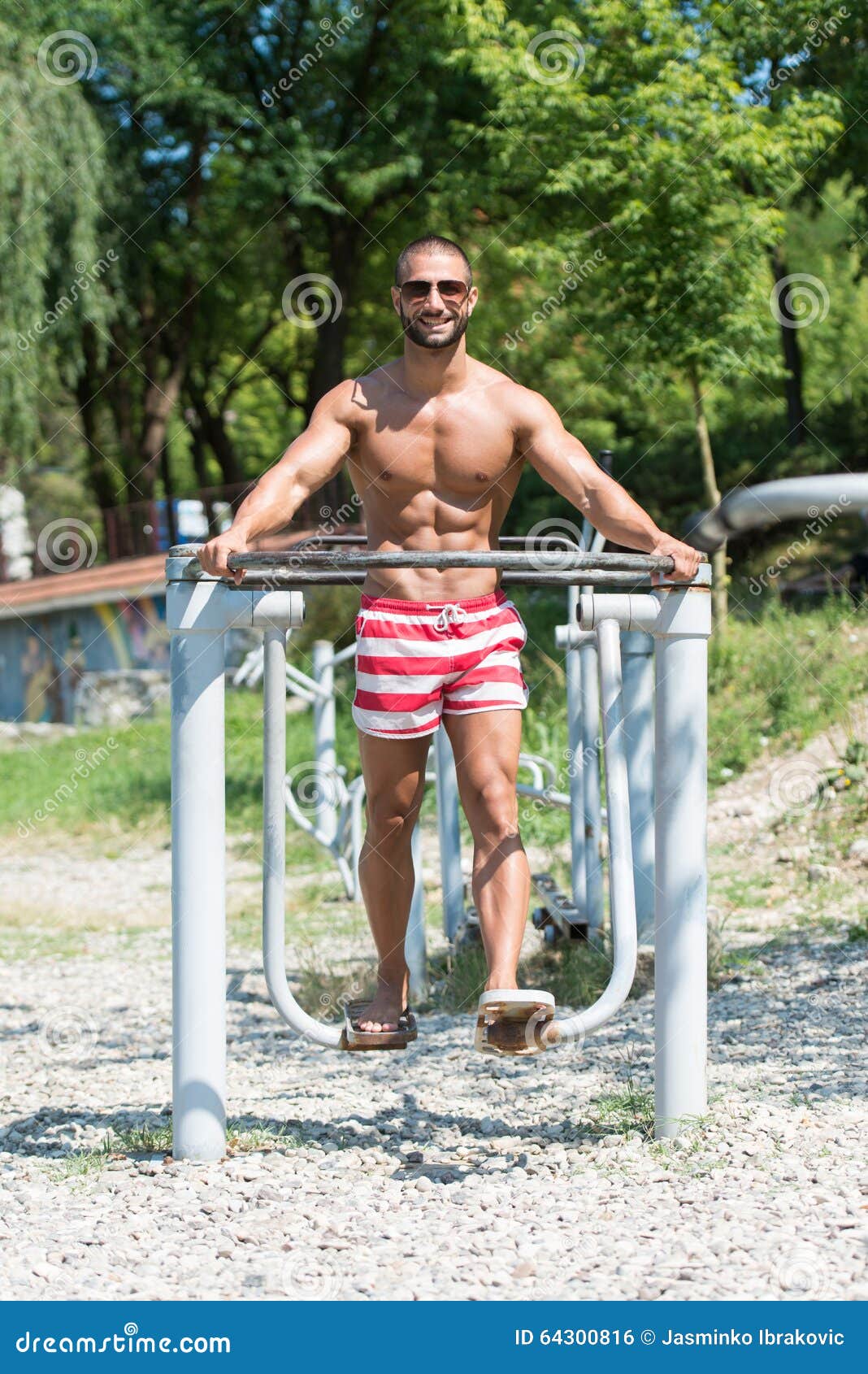 Muscular Man Training on the Playground in Park Stock Photo - Image of ...