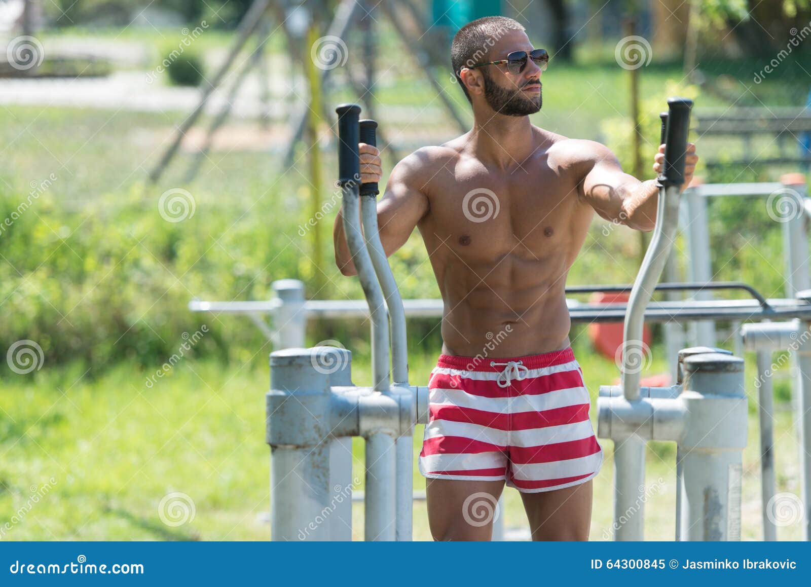 Muscular Man Training on the Playground in Park Stock Image - Image of ...