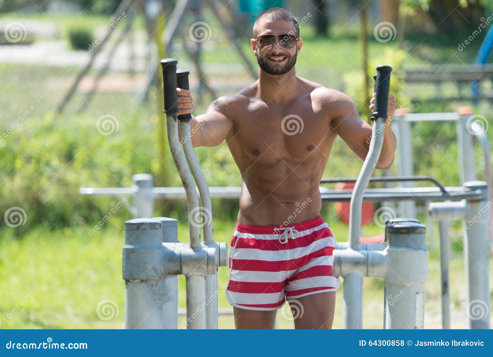 Muscular Man Training on the Playground in Park Stock Photo - Image of ...