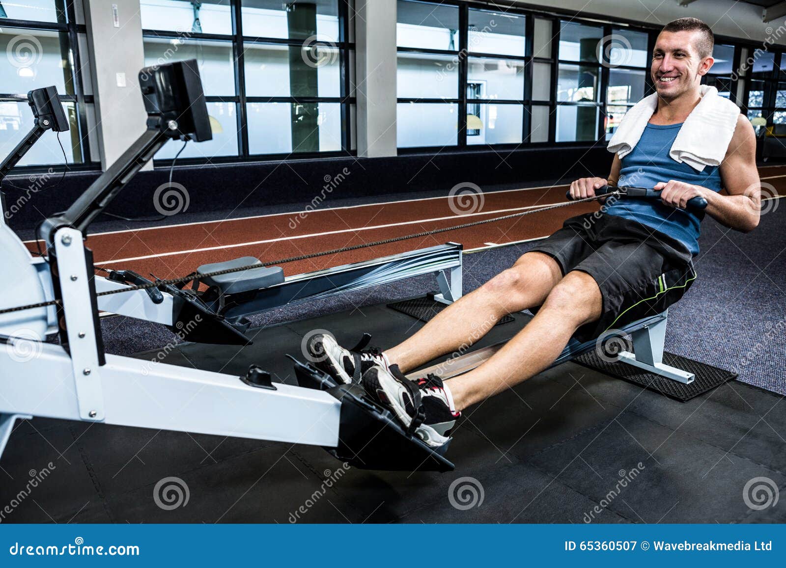 Muscular Man Using Rowing Machine Stock Image - Image of recreation ...
