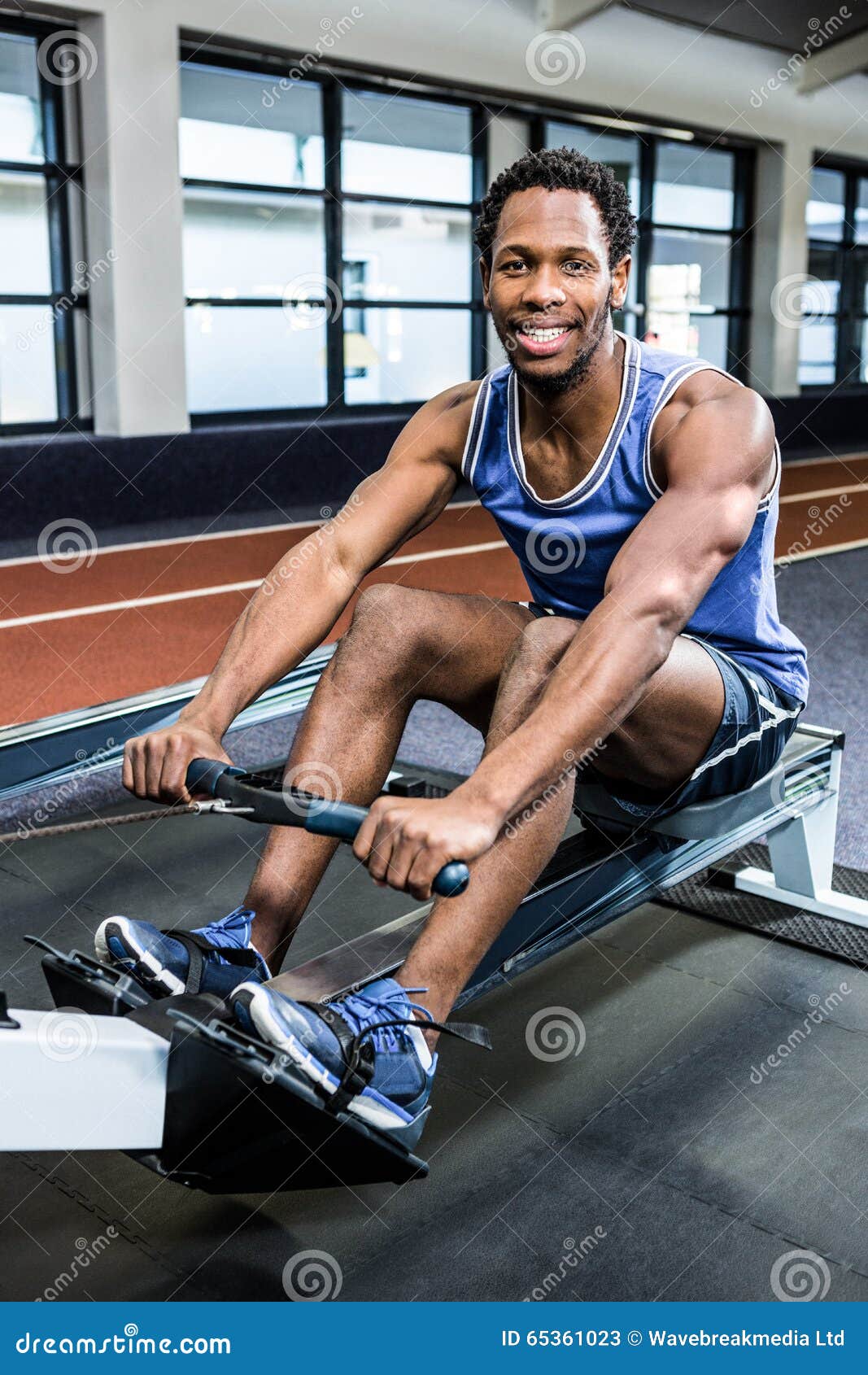 Muscular Man Using Rowing Machine Stock Image - Image of fitness ...