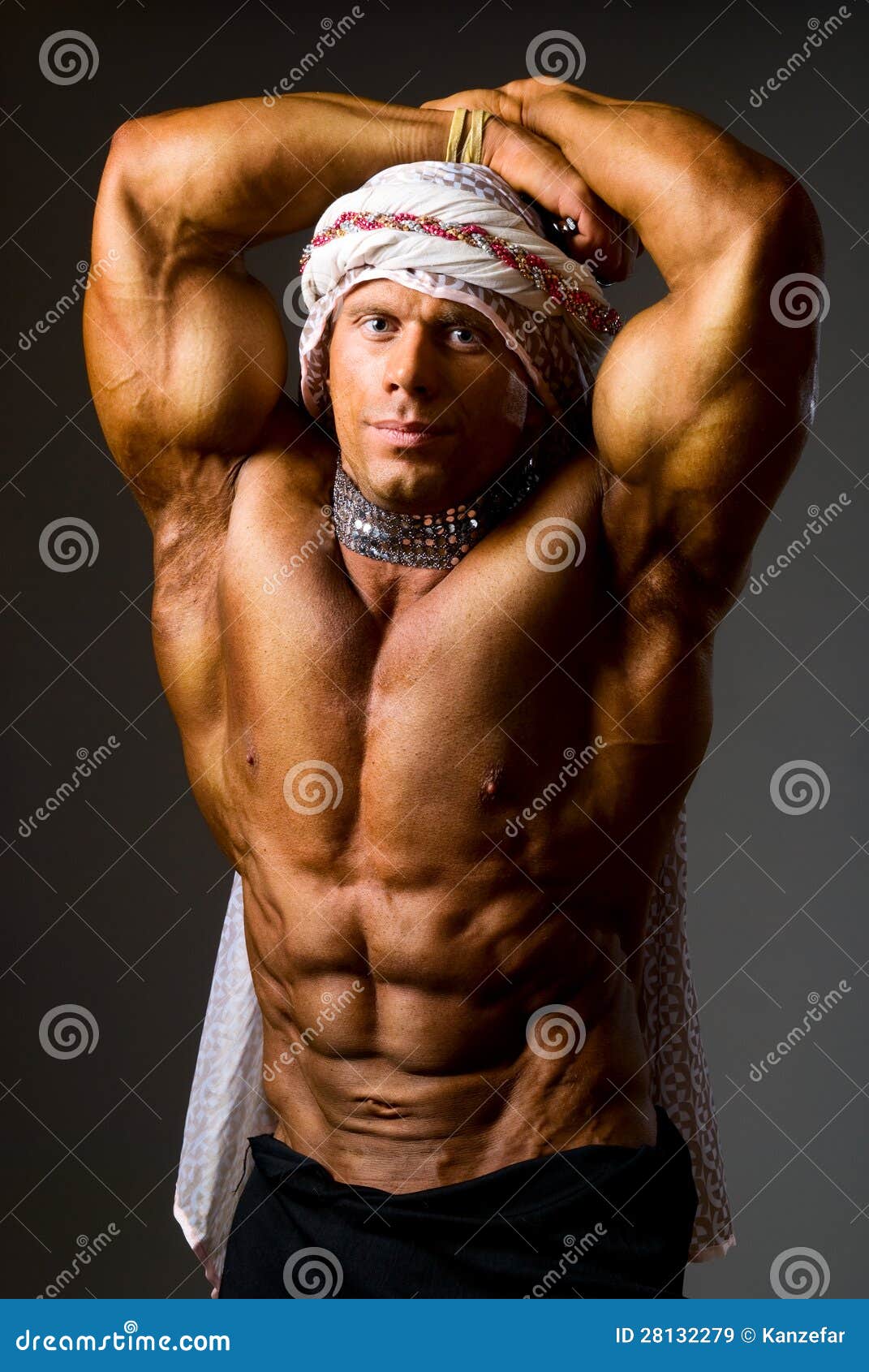 Muscular Man Wearing a Middle Eastern Headdress Stock Image - Image of ...
