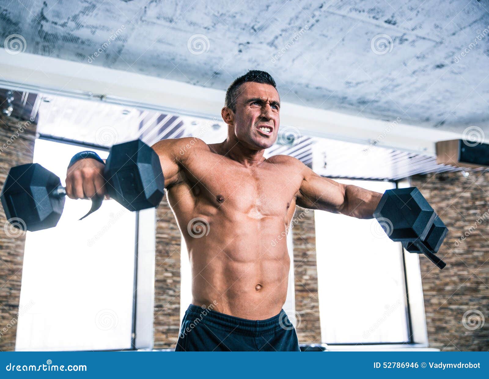 Muscular Man Workout with Dumbbells Stock Photo - Image of lifting ...