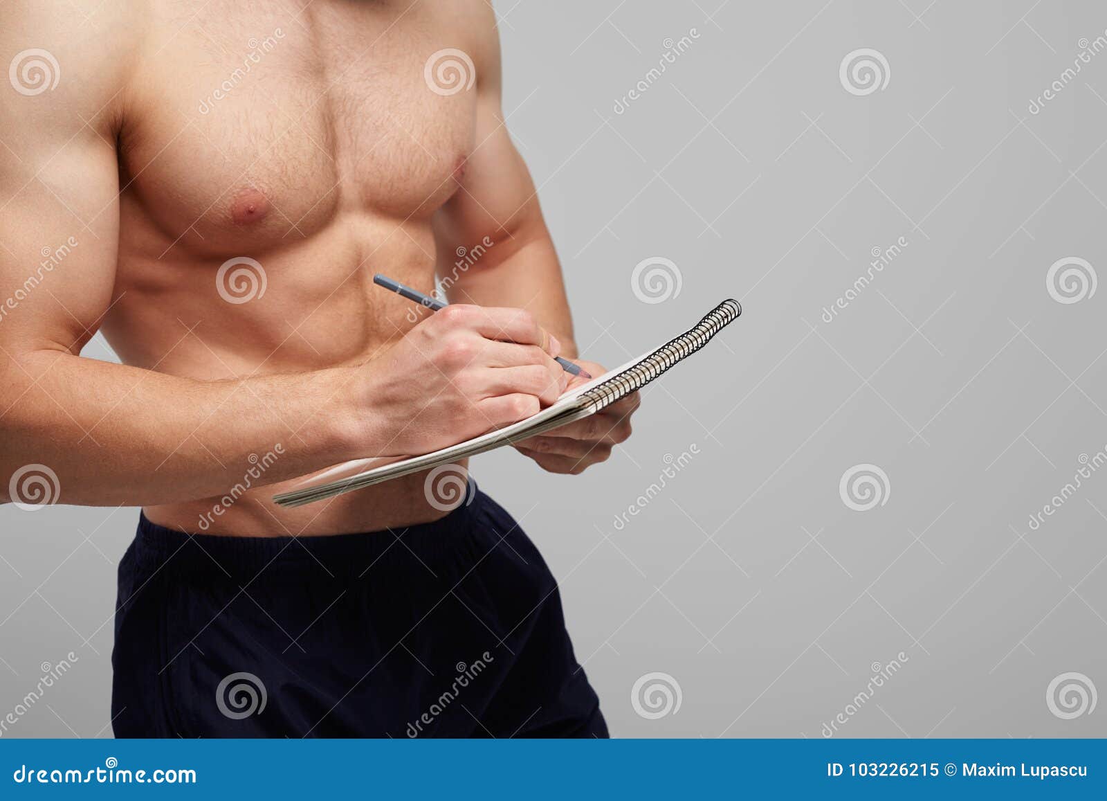 Muscular Man Writing in Notepad Stock Image - Image of measure ...