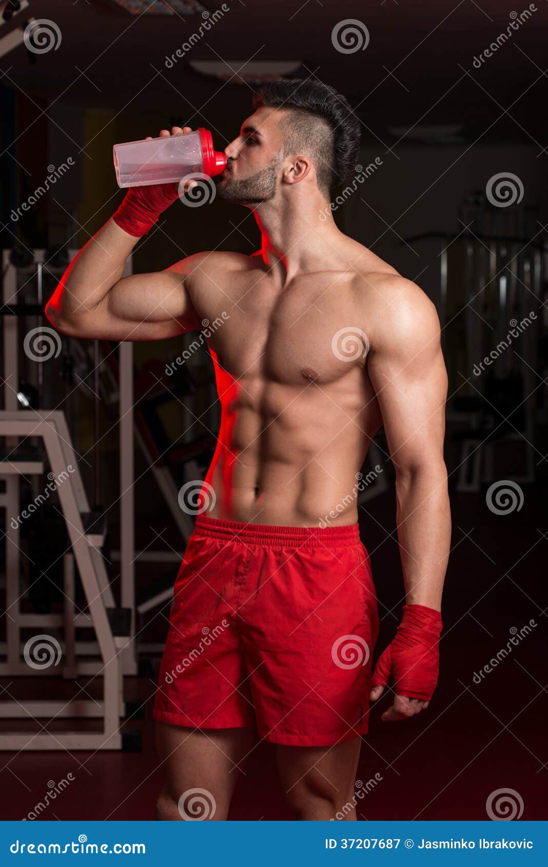 Muscular Men Drinking Water from Shaker Stock Image - Image of ...