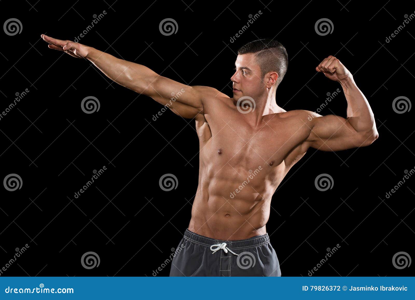 Muscular Men Flexing Muscles on Black Background Stock Photo - Image of ...