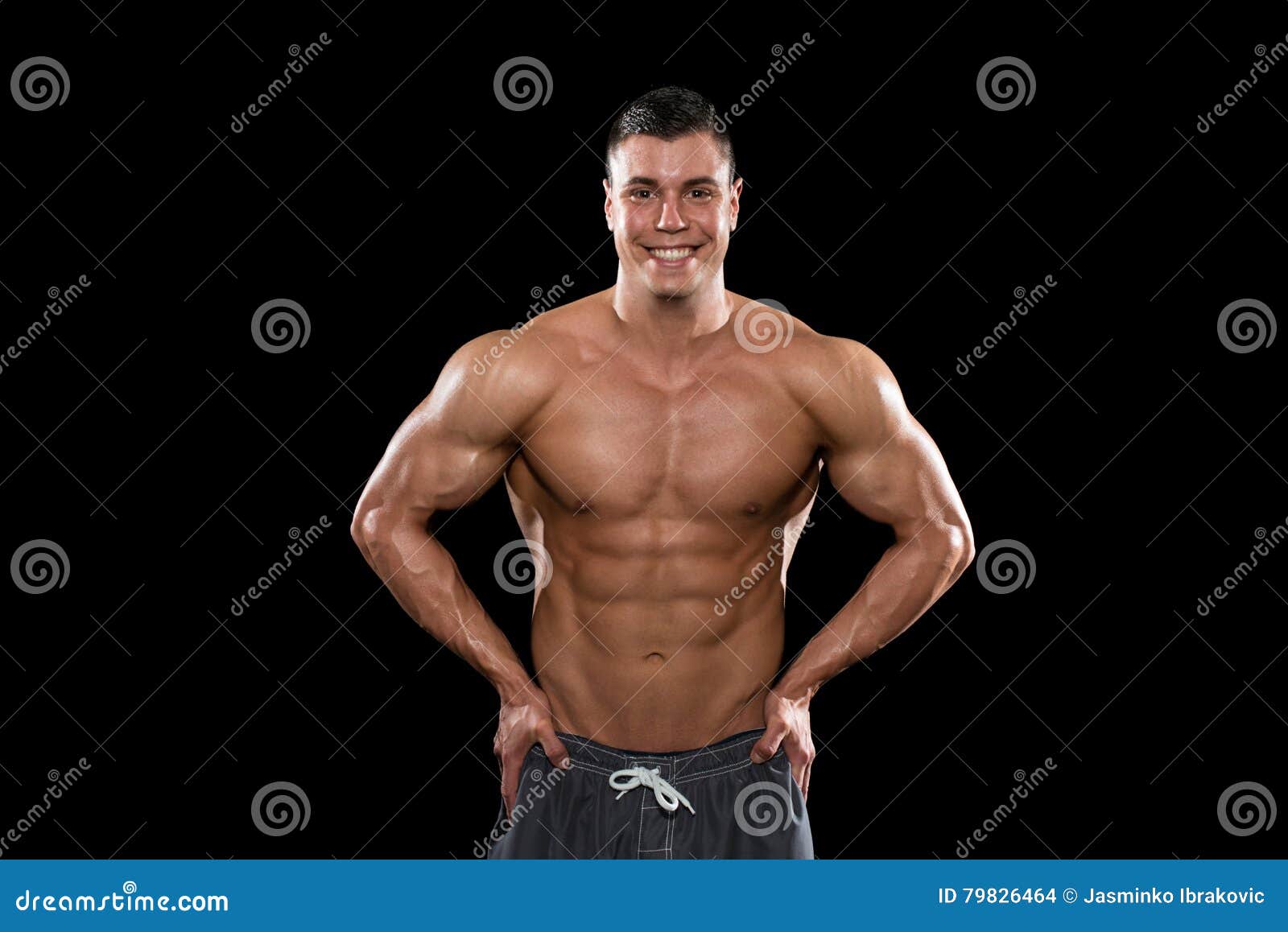 Muscular Men Flexing Muscles on Black Background Stock Photo - Image of ...