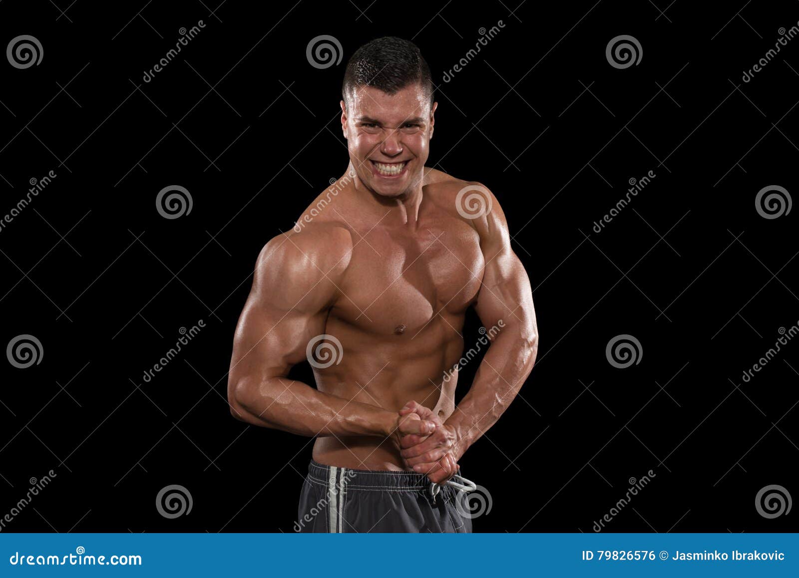 Muscular Men Flexing Muscles on Black Background Stock Photo - Image of ...