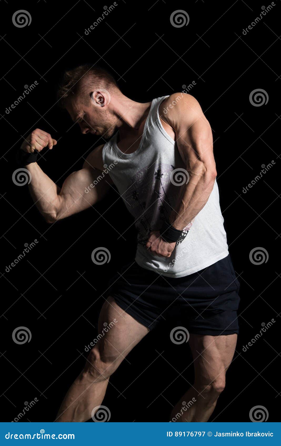 Muscular Men Flexing Muscles on Black Background Stock Image - Image of ...