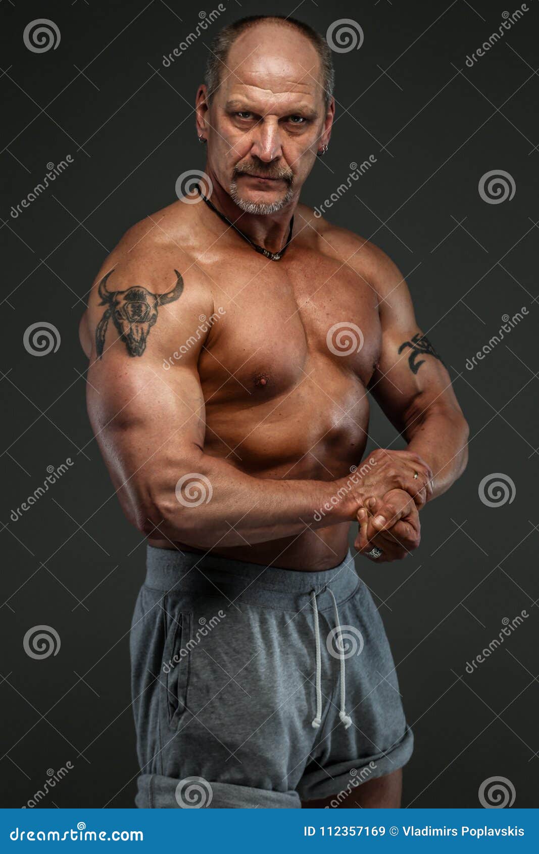 Muscular Middle Aged Woman Flexing Muscles Stock Photography ...