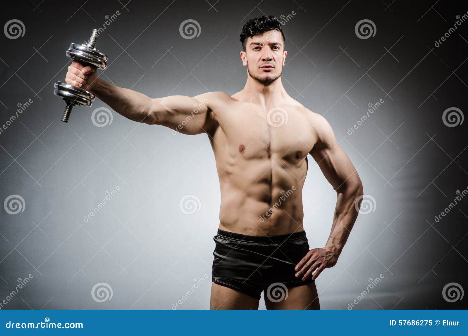 Muscular Ripped Bodybuilder with Dumbbells Stock Image - Image of body ...