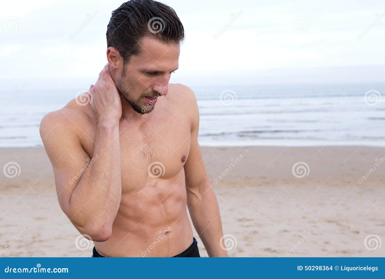 Muscular Surfer on Beach stock photo. Image of healthy - 50298364