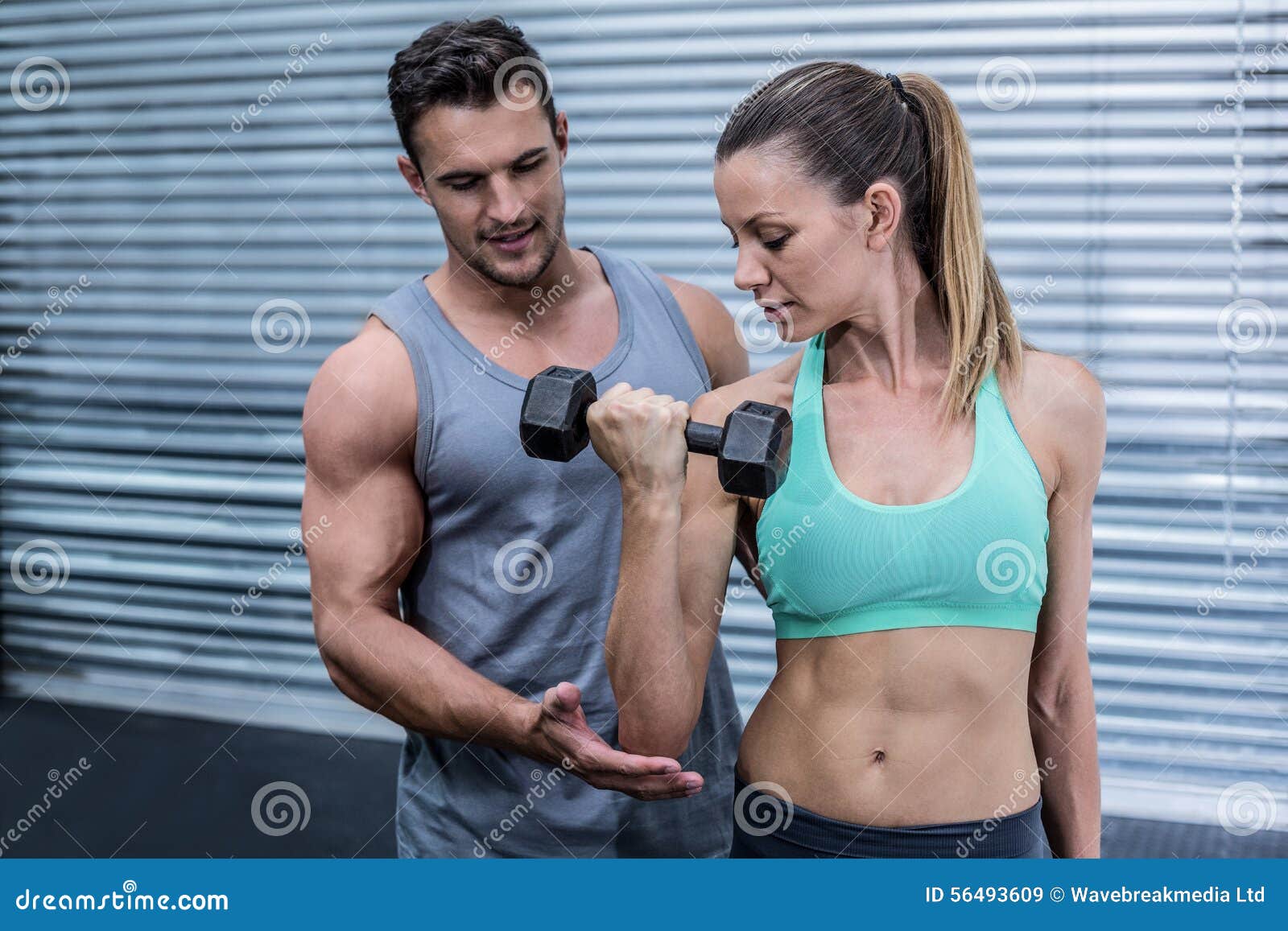 A Muscular Woman Lifting Dumbbells Stock Image Image Of Health
