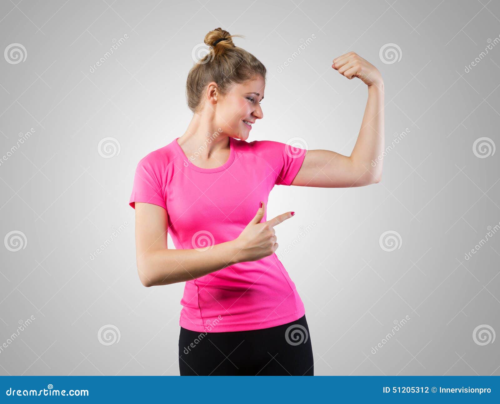 Muscular Woman Pointing on Her Bicep Stock Photo - Image of confidence ...