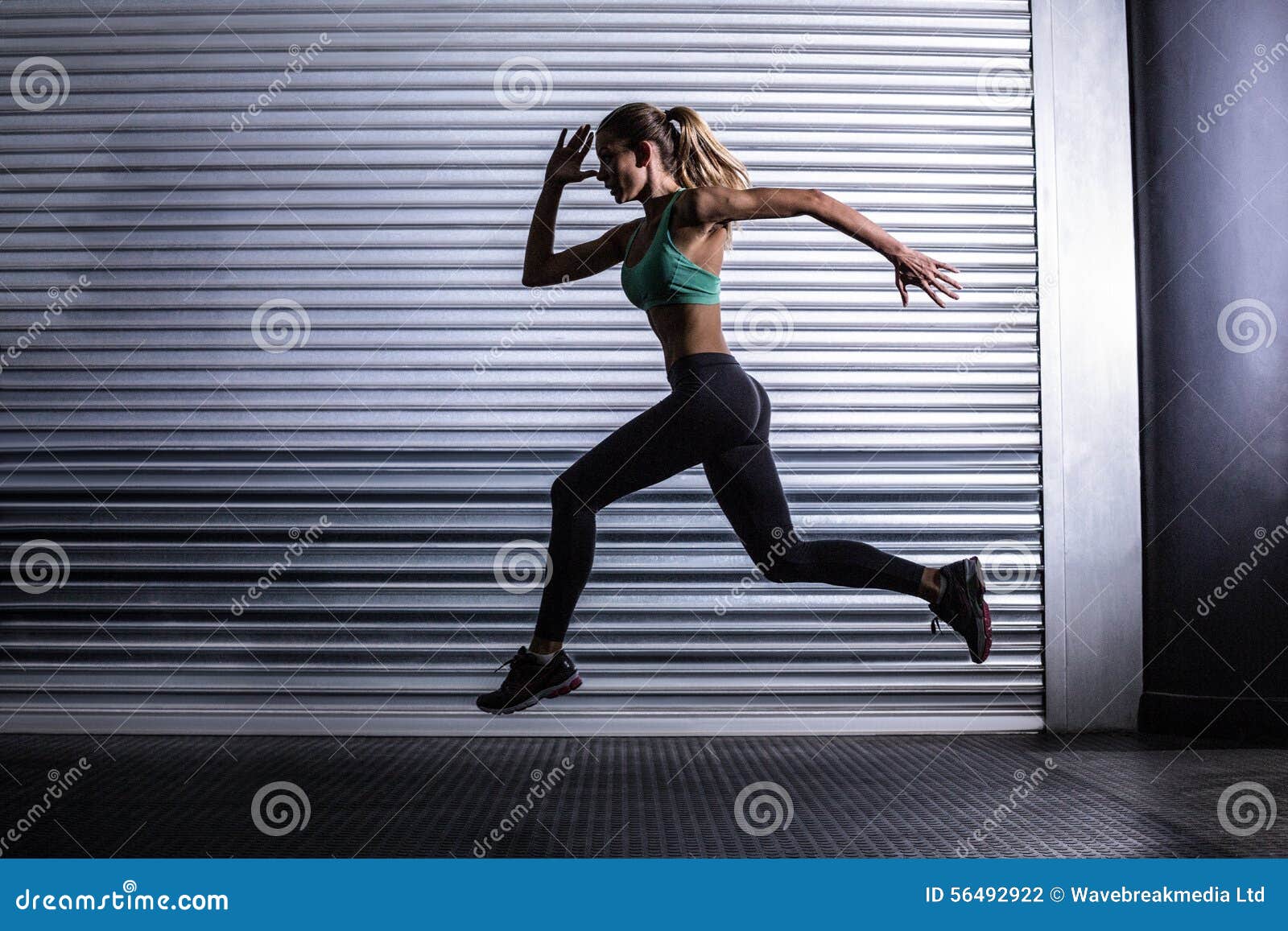 Muscular Woman Running in Exercise Room Stock Photo - Image of leisure ...