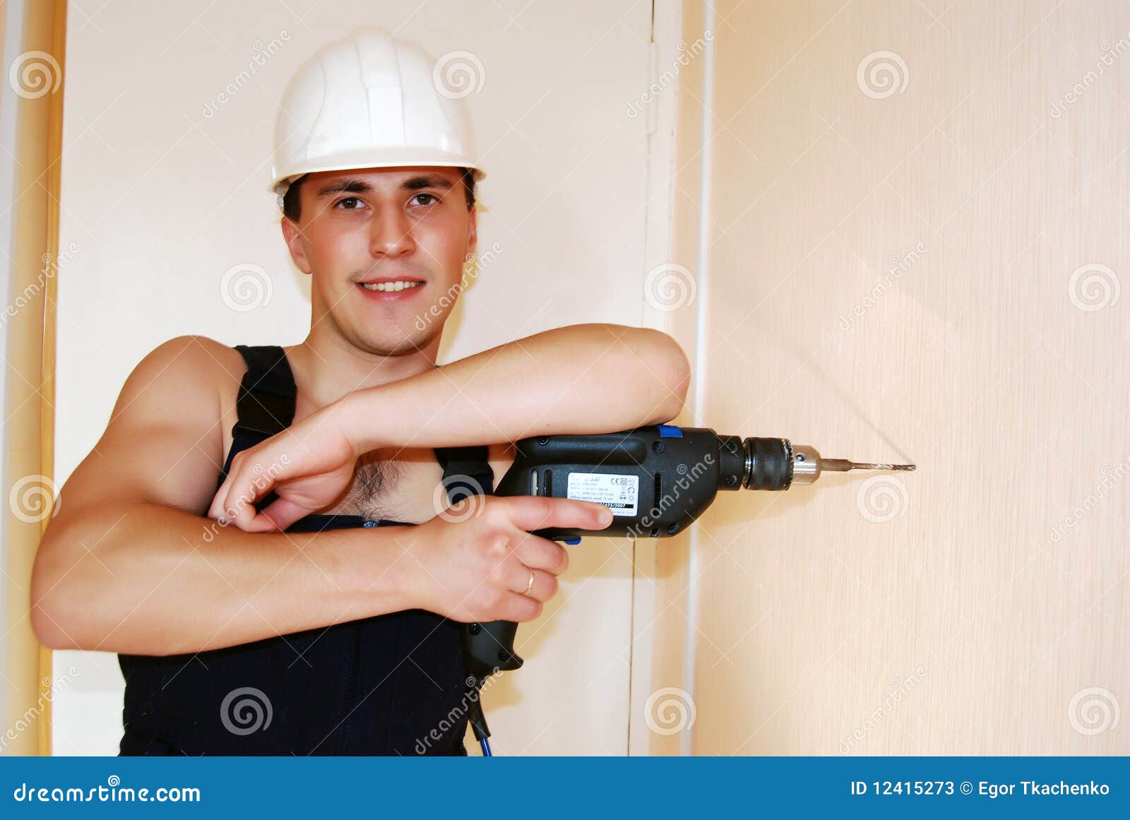 Muscular young builder. stock image. Image of realty - 12415273