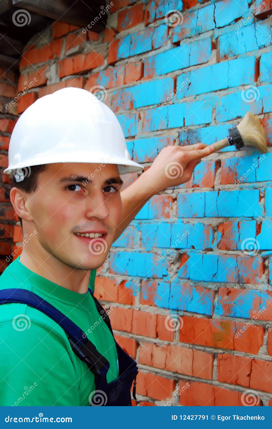 Muscular young builder. stock image. Image of decoration - 12427791