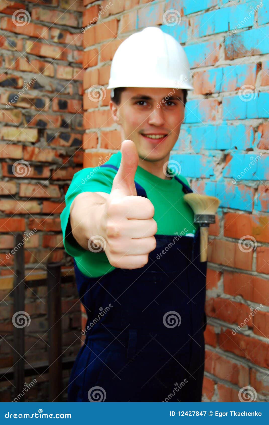 Muscular young builder. stock image. Image of finger - 12427847