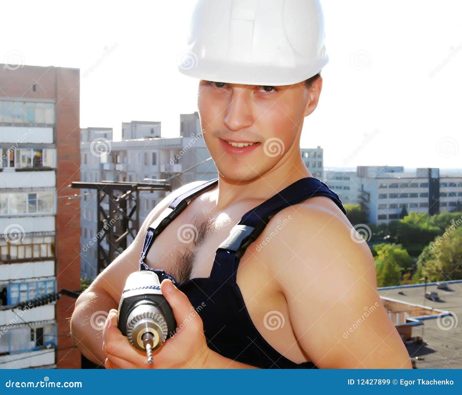 Muscular young builder. stock image. Image of builder - 12427899