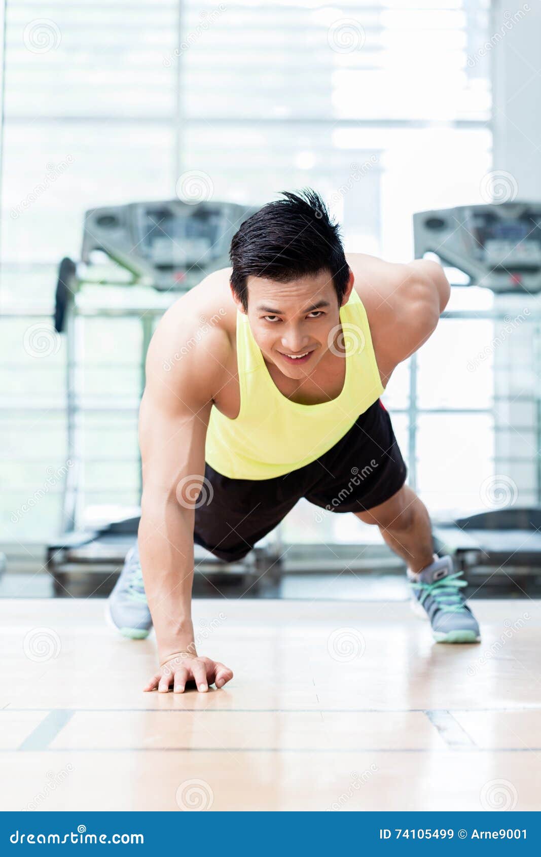 Muscular Young Man Doing One Armed Pushups in Gym Stock Image - Image ...