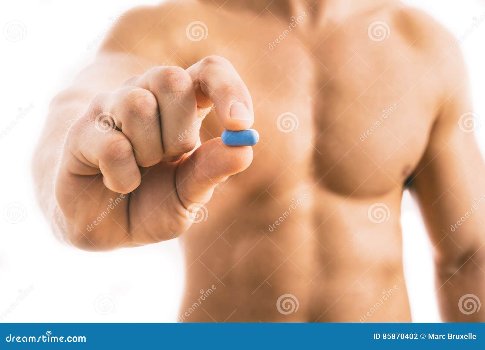 Muscular Young Man Holding Blue Pill Stock Photo - Image of background ...