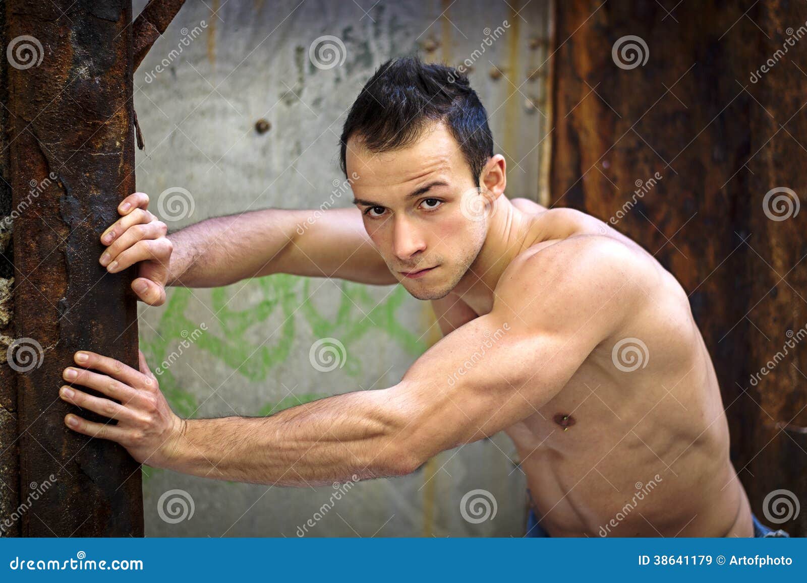 Muscular Young Man Leaning Against Rusty Metal Stock Image - Image of ...