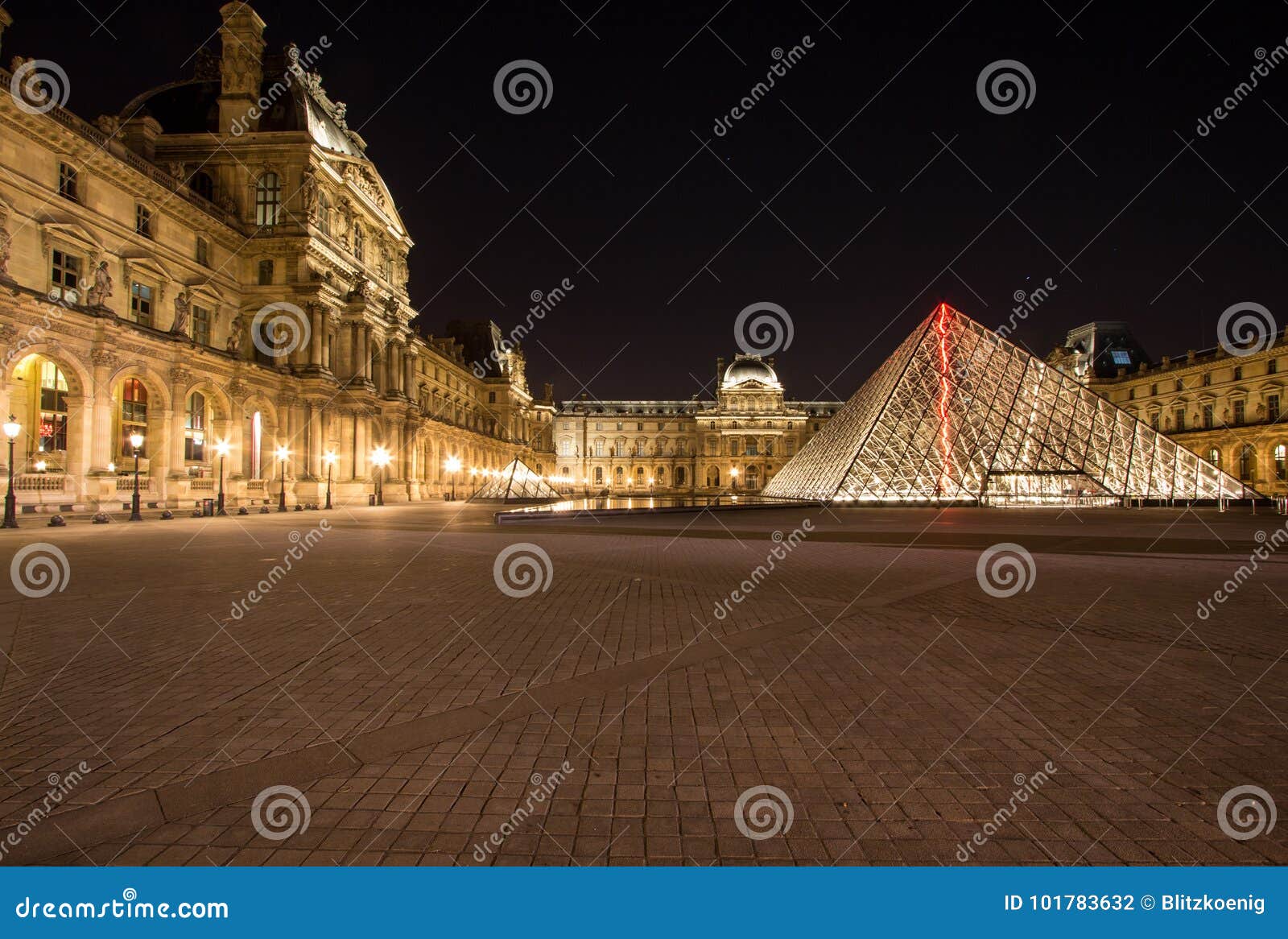 Musee Du Louvre Sign In Front Of The Large Glass Pyramid At The Louvre ...