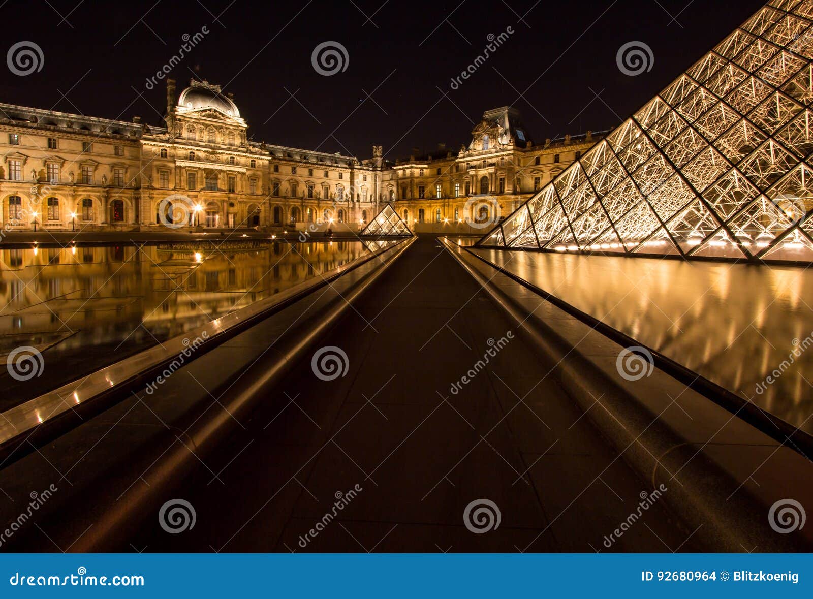Musee Du Louvre Sign In Front Of The Large Glass Pyramid At The Louvre ...
