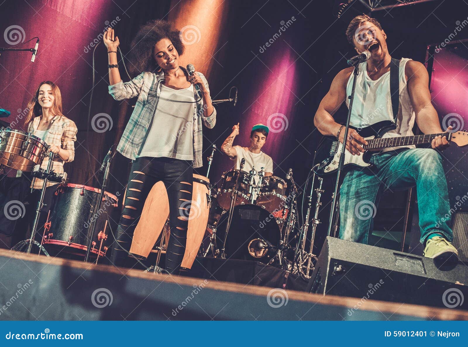 Music Band Performing on a Stage Stock Image - Image of black, playing ...