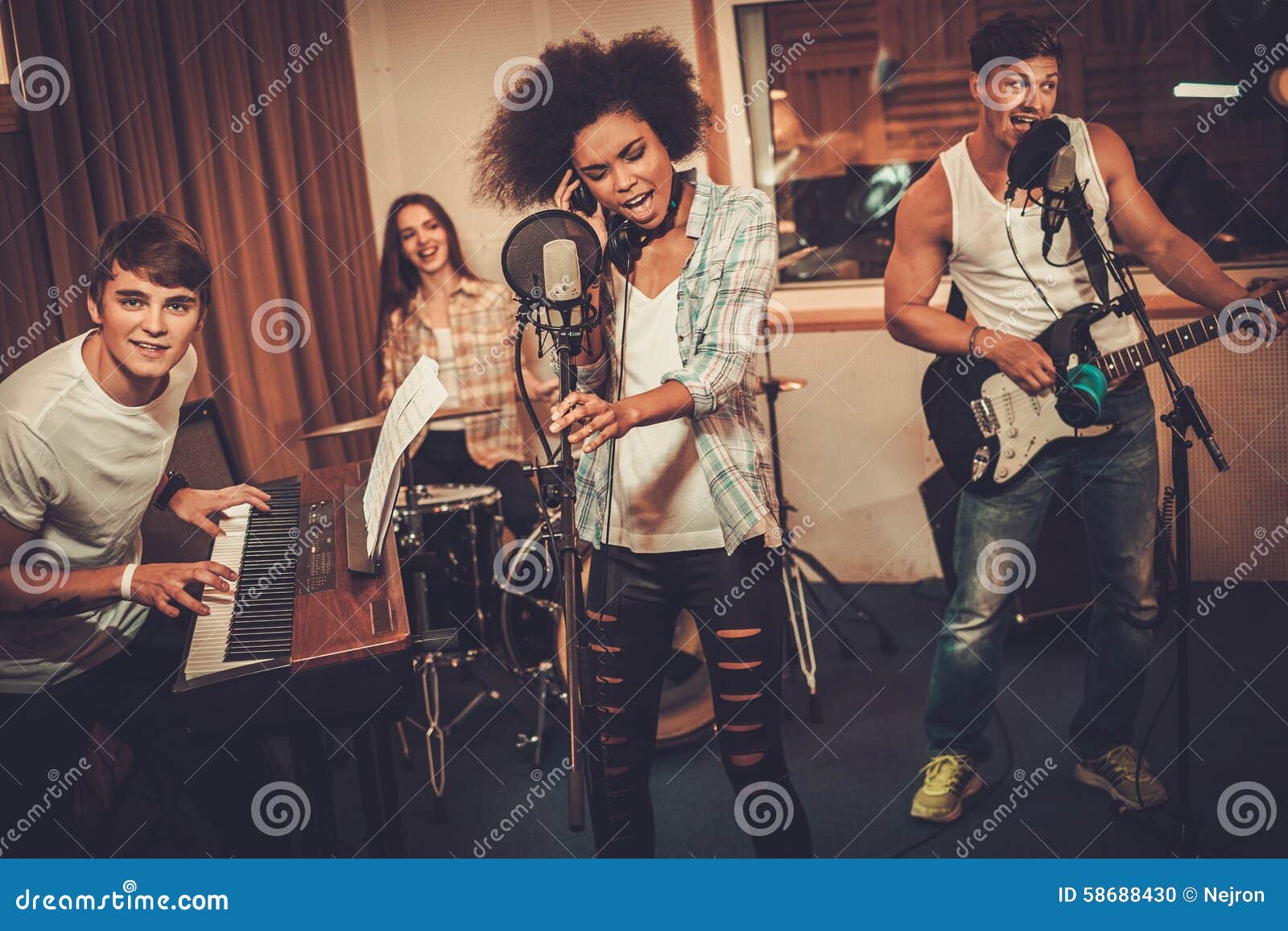 Music Band Performing in a Studio Stock Photo - Image of playing, drums ...