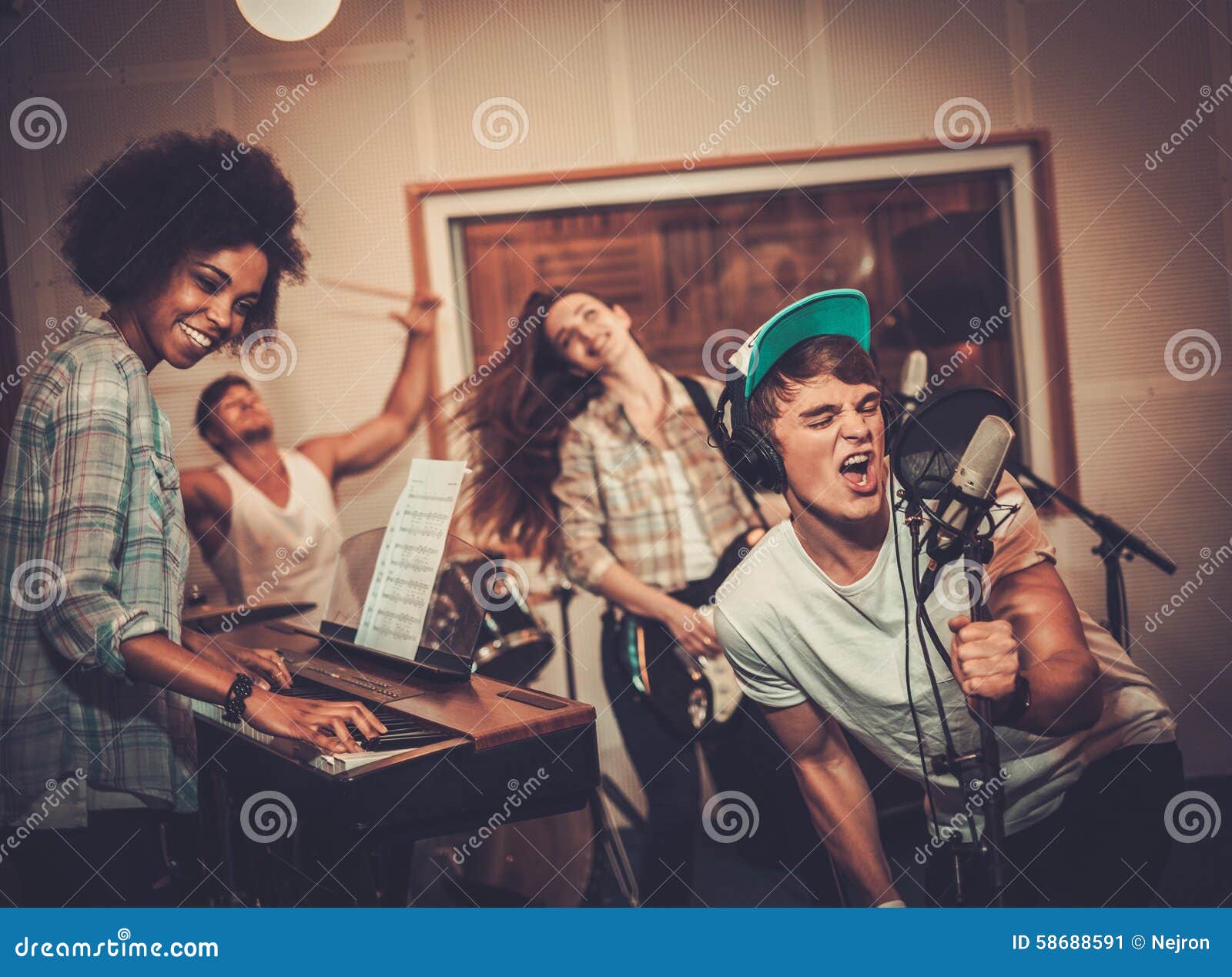 Music Band Performing in a Studio Stock Image - Image of multinational ...