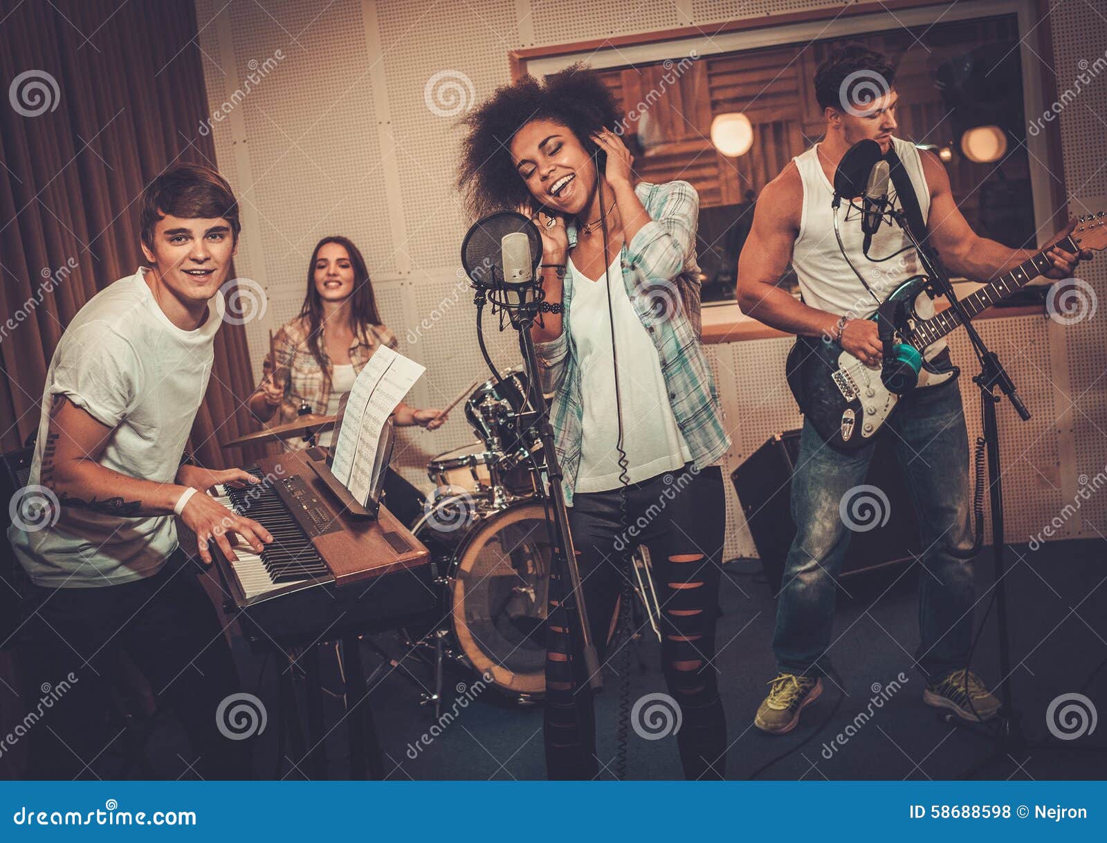Music Band Performing in a Studio Stock Photo - Image of emotional ...