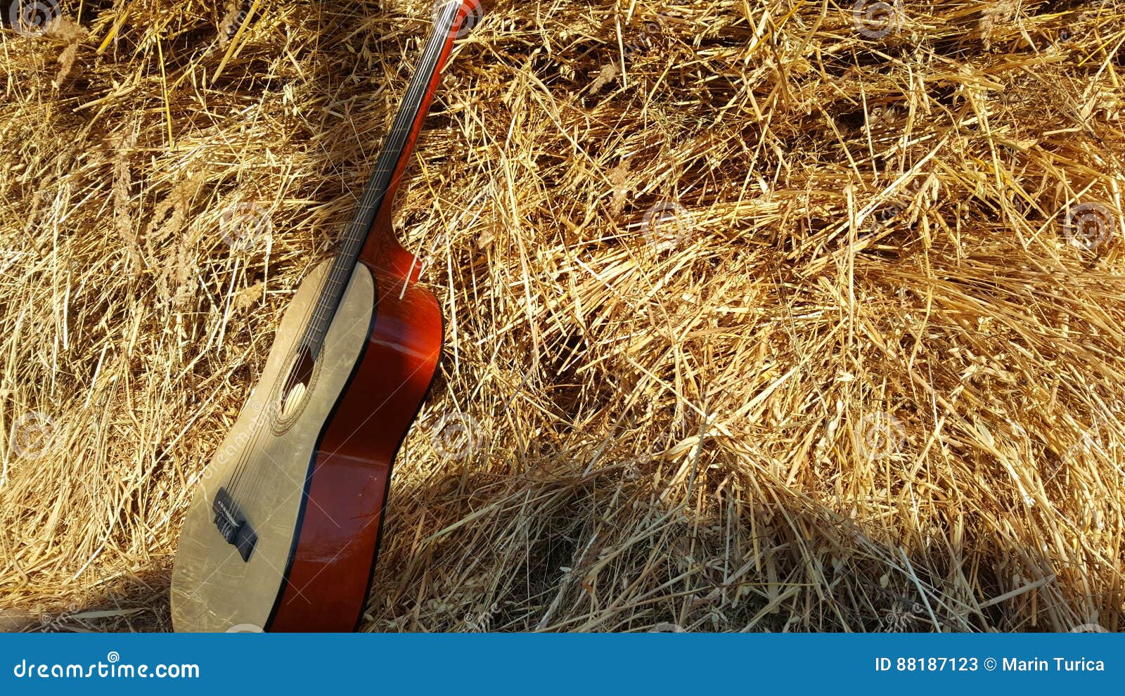 Music Instrument Guitar Leaning on the Haystack Stock Image - Image of ...
