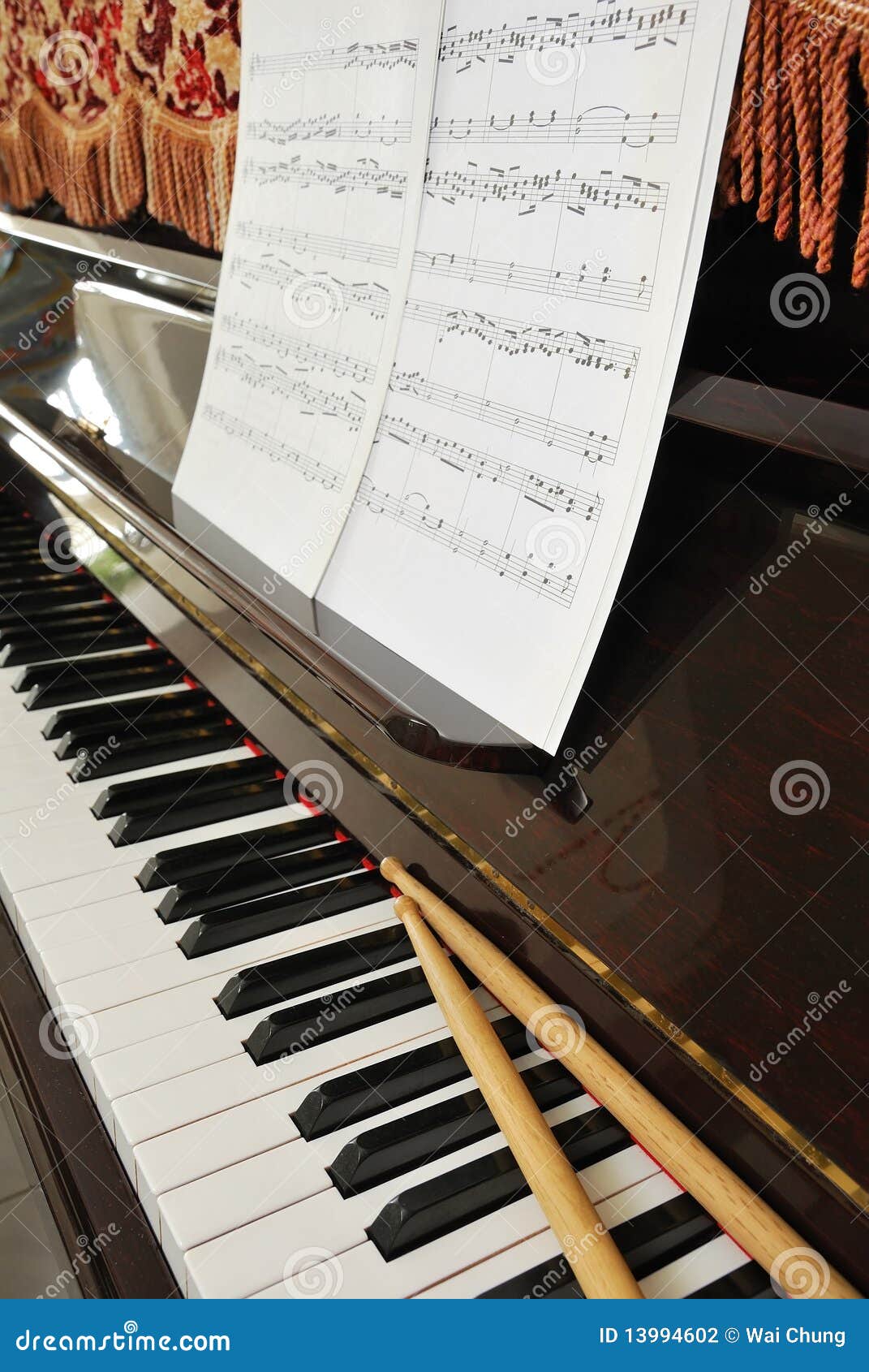 Music Score and Drum Sticks on Piano Keyboard Stock Photo - Image of ...